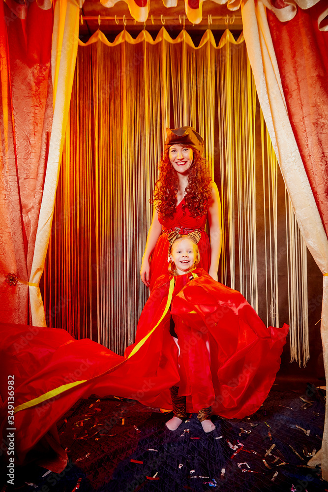 Family during a stylized theatrical circus photo shoot in a beautiful ...