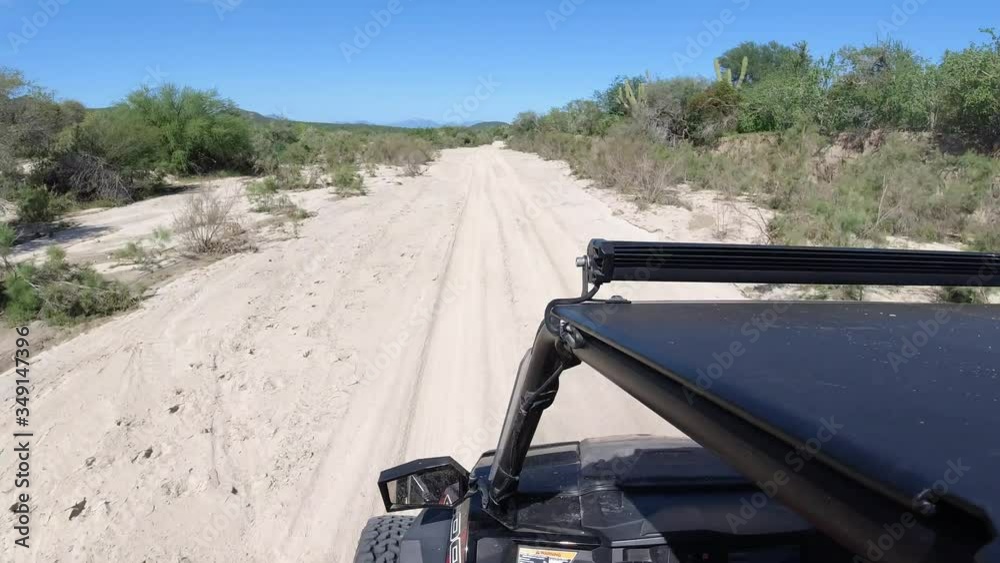 LOS CABOS MEXICO-2019: A Vehicle Is Driving On A Rocky Road Surrounded ...