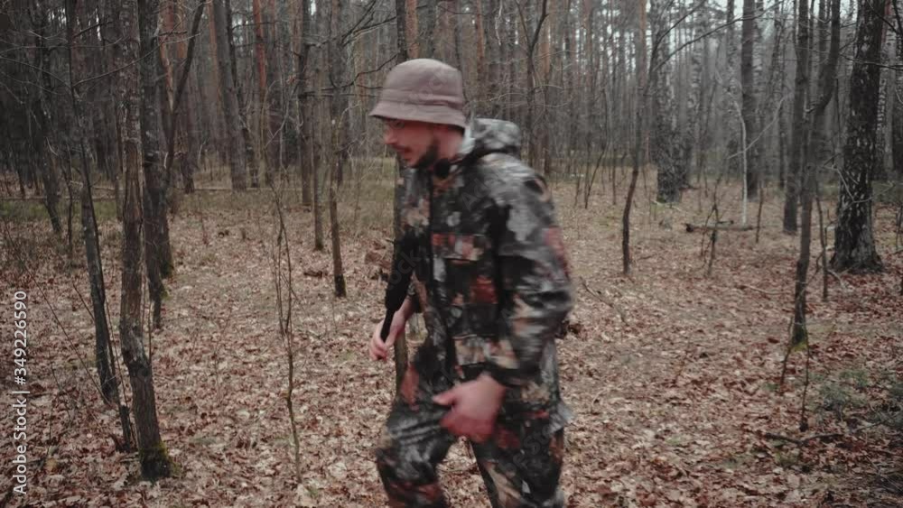 Strange correspondent reporter with microphone. Hunter forest ranger ...