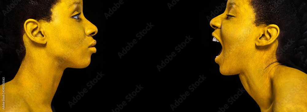 Woman with yellow body paint. Cheerful young african girl with ...