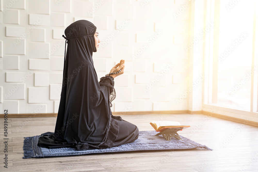 beautiful asian muslim woman holding hands in chest embracing with ...