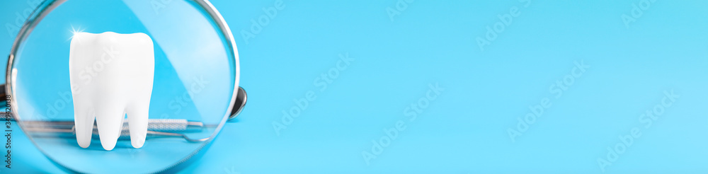 Dental model and dental equipment on blue background, concept image of ...