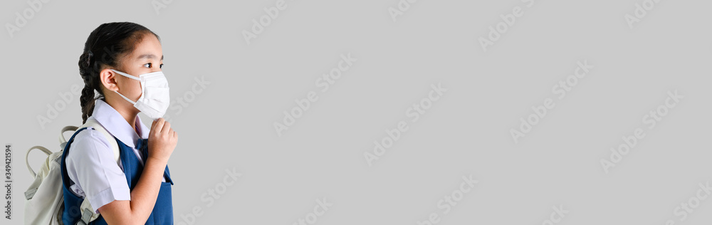 School Girl wearing mouth mask to protection for coronavirus on Gray ...