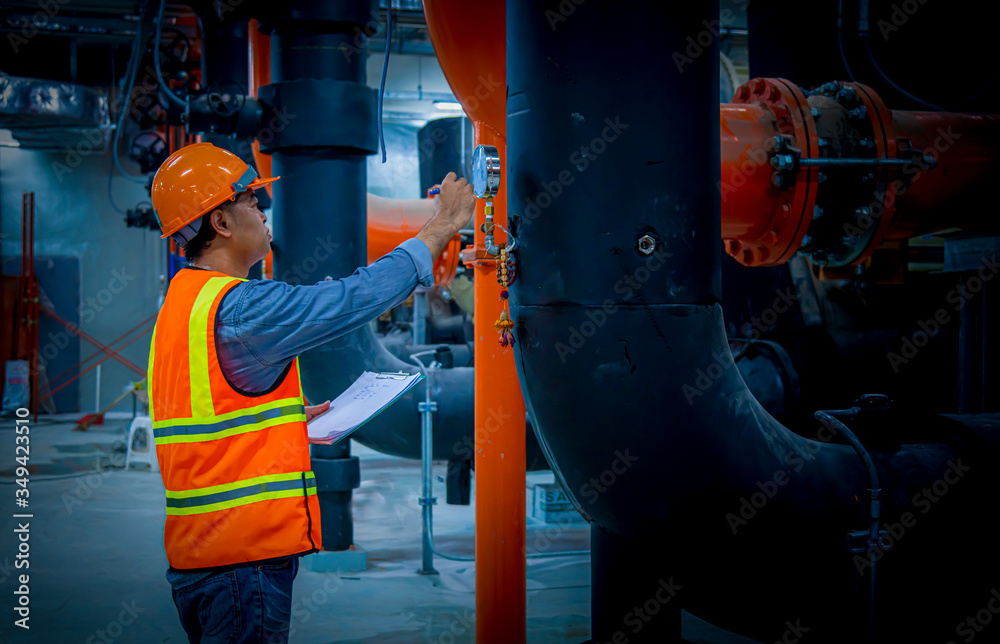 A engineer under checking the industry cooling tower air conditioner is ...