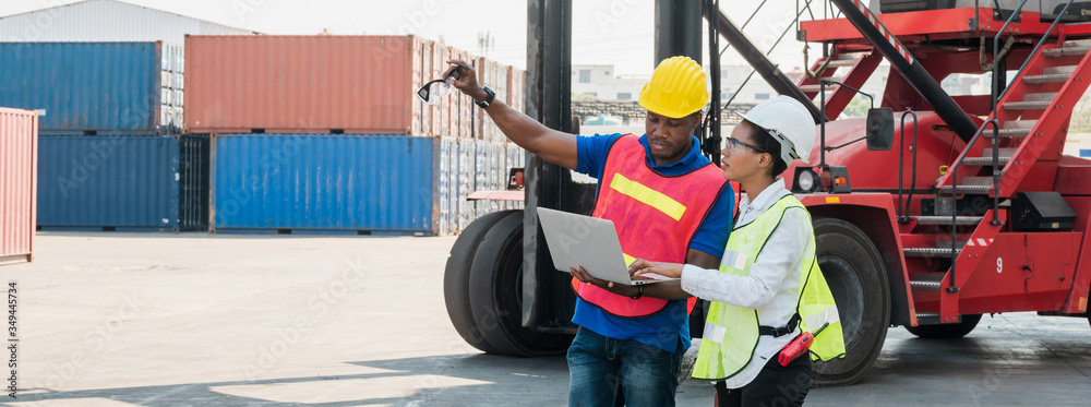 Two Black foreman man & woman worker working checking at Container ...
