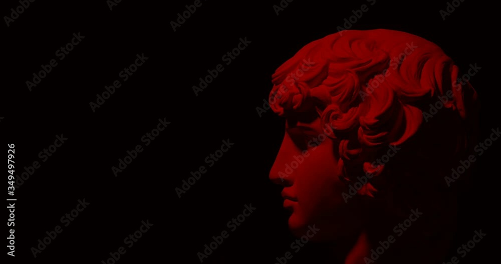 Epic studio shot of rotating gypsum head with moving and changing red ...