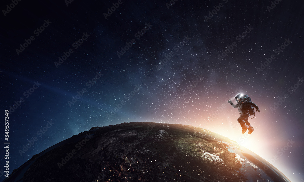 Astronaut in space on planet orbit. Stock Photo | Adobe Stock
