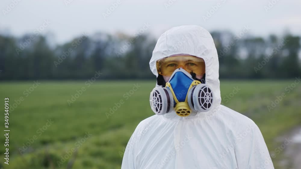 Portrait mature man farm worker wearing hazmat protective suit gas ...