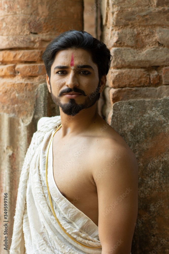 Portrait of an Indian pujari/ worshiper in bare body Indian ethnic ...