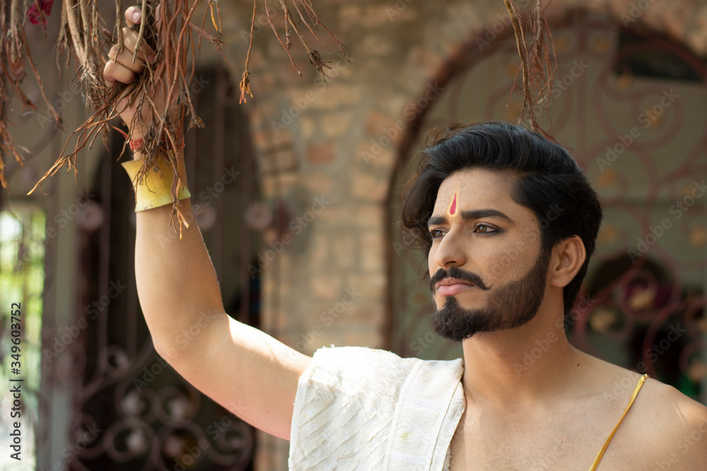 portrait of an Indian pujari/ worshiper in bare body Indian ethnic ...