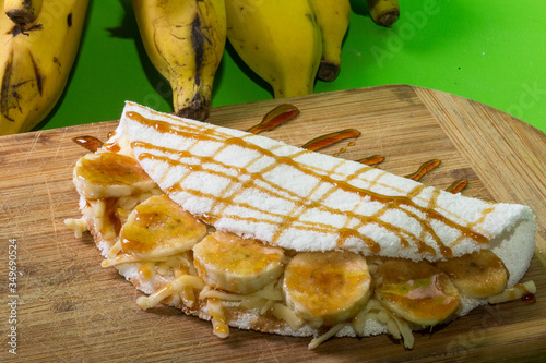 Tapioca with banana and cheese and honey. flatbread made from cassava ...