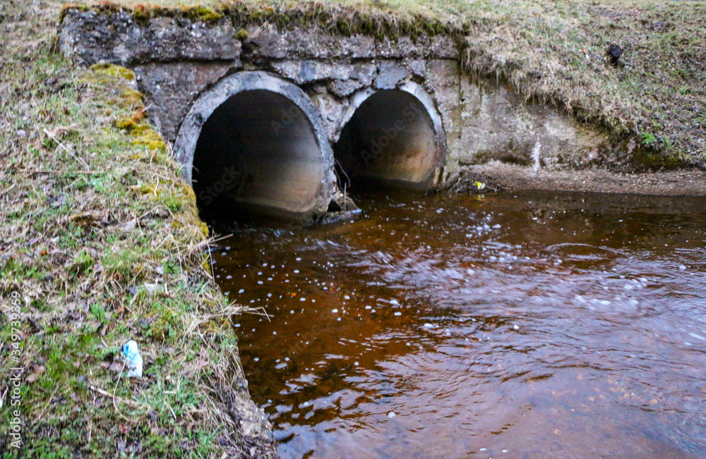 drainage pipes made of concrete under the road, to divert water during ...