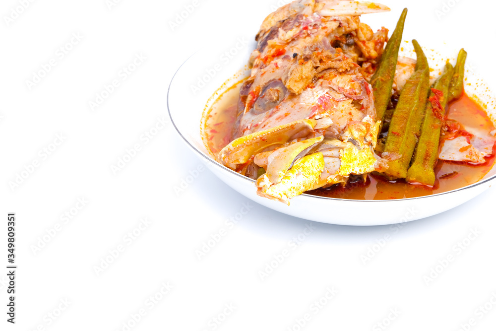 A high key picture of red snapper "asam pedas" on white background ...