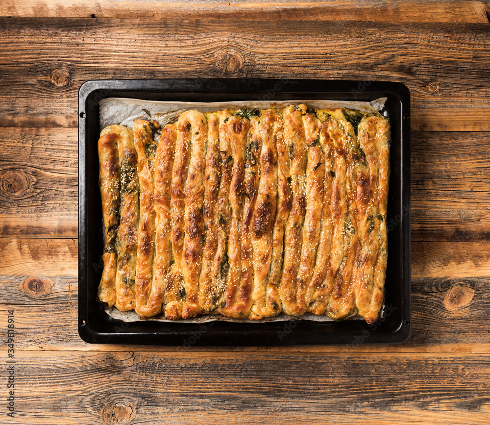 Traditional Turkish pastry with spinach. (Turkish Name: Ispanakli Kol ...