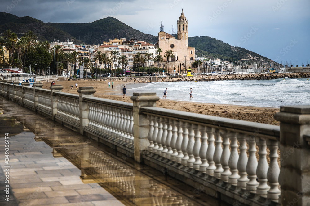 Small village at the beach with a balustrade reflection on the floor ...