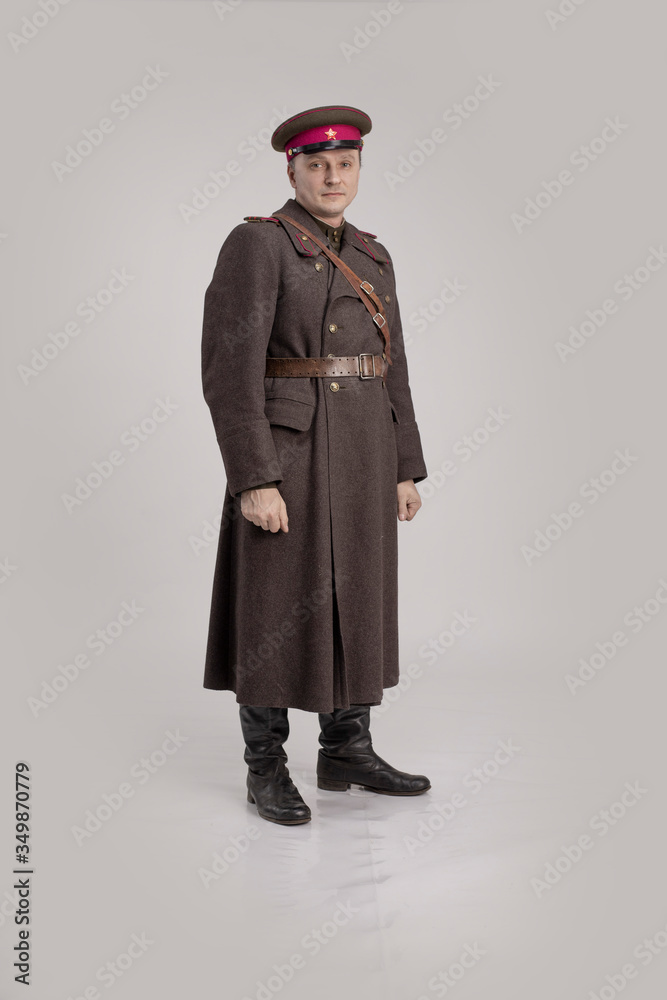 Actor man in an old military uniform of an officer of the Soviet army ...
