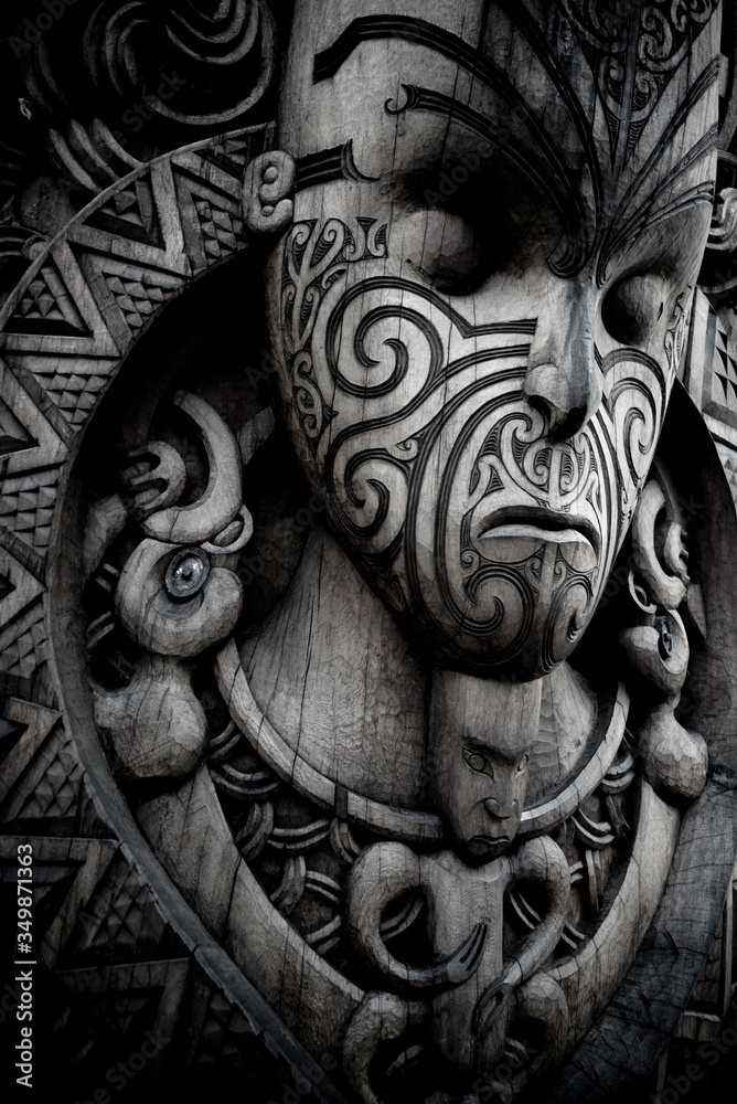 Maori traditional carving outside Marae. Ta moko. New Zealand. Stock ...