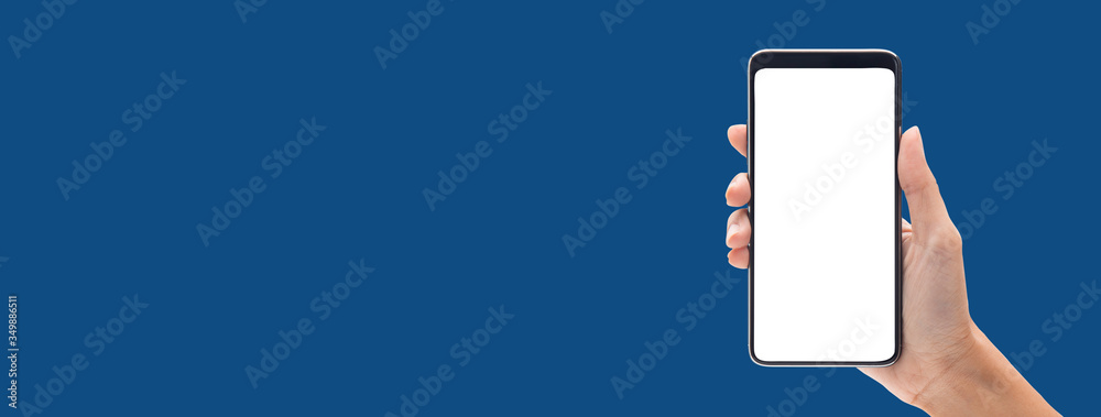Hand holding the black smartphone on colorful blue banner background ...
