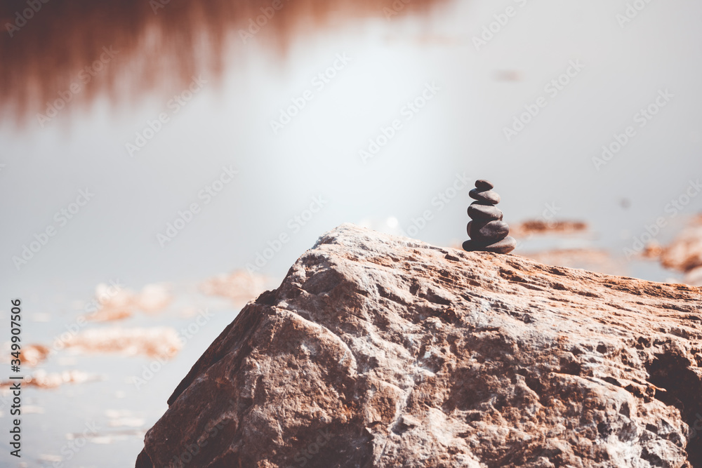 Pyramid of stones installed on large stone. House for the soul and ...