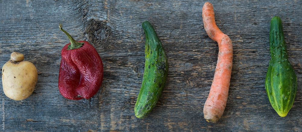 Ugly vegetables, different types of deformed vegetables on a rustic ...