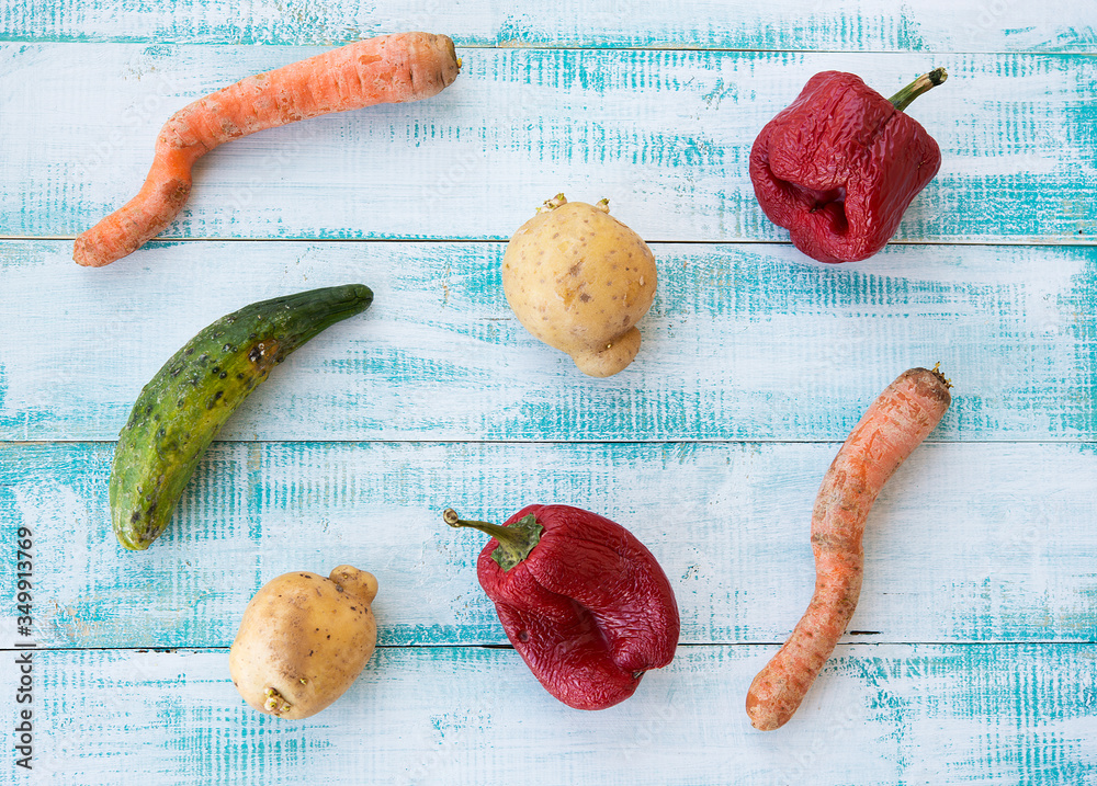 Ugly vegetables, different types of deformed vegetables on a rustic ...