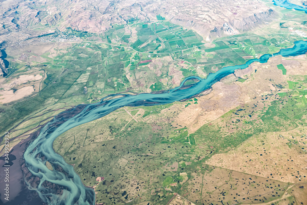Iceland bird's eye high angle view of Thorsa river turquoise water from ...