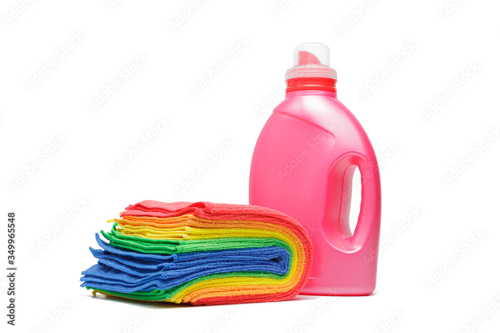 Stack of clean things with mockup blank bottle of detergent for laundry ...