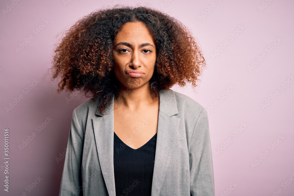 Young african american businesswoman with afro hair wearing elegant ...