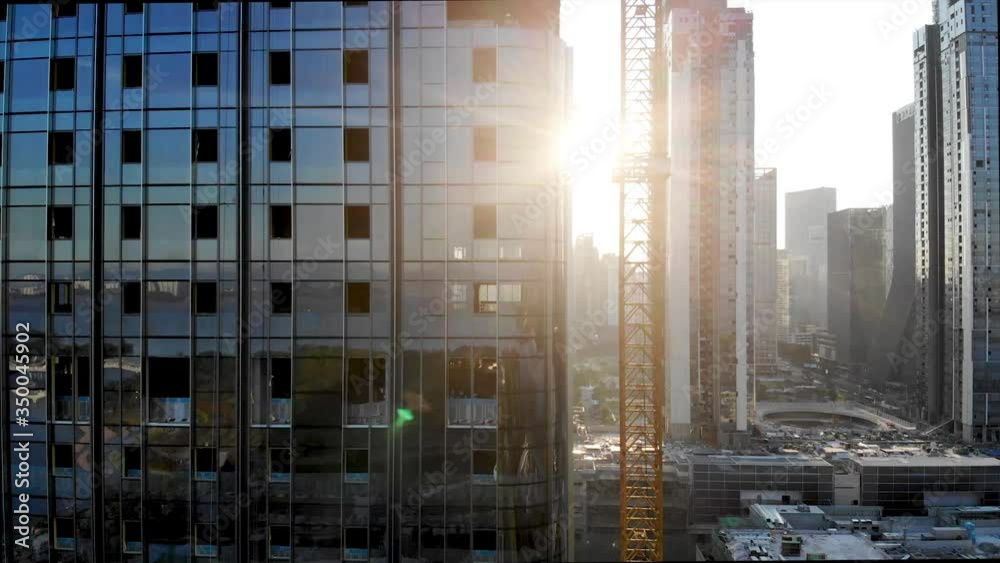 Workers are Building High-rise and Installing the Precast Glass Panel ...