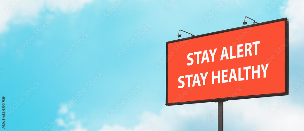 Stay Alert Stay Healthy warning sign on blue sky background. Large ...
