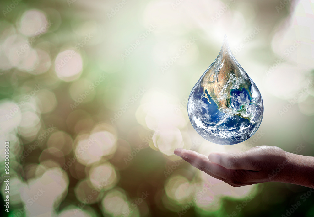 world day for water. earth drop on hand and sun rise morning.hands wait ...