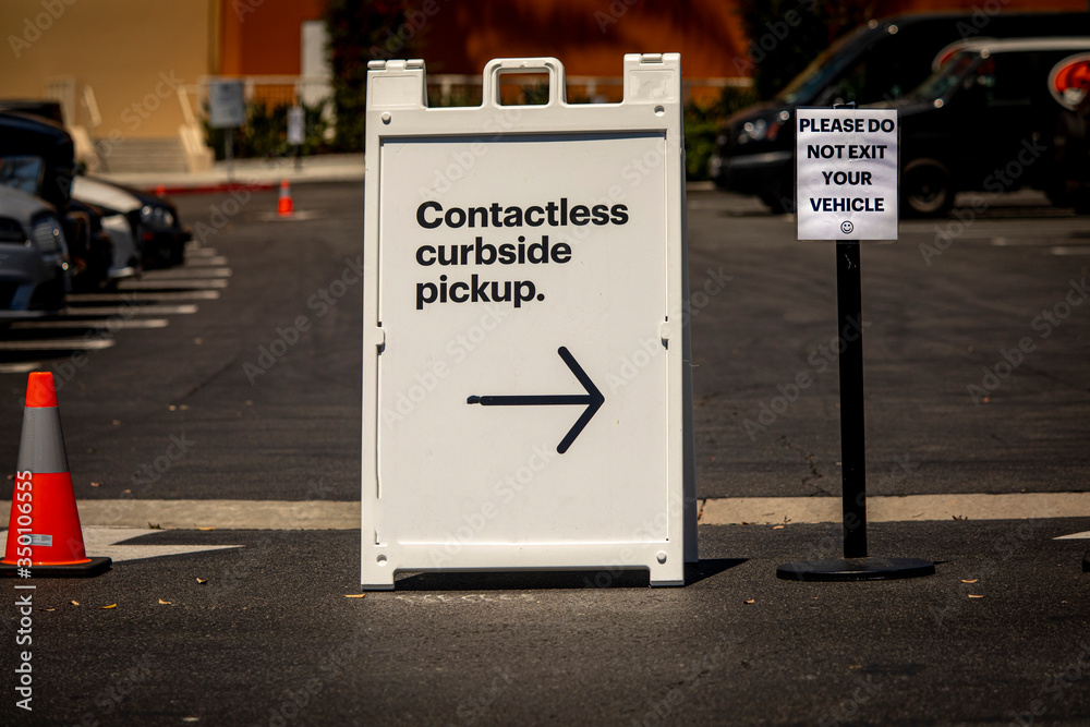 Sign advertising Contactless Curbside Pickup at retail store parking ...