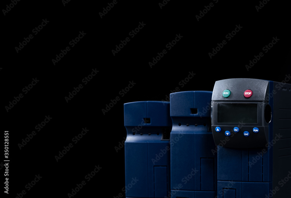 Frequency inverter. Three inverter controller set isolated on black ...