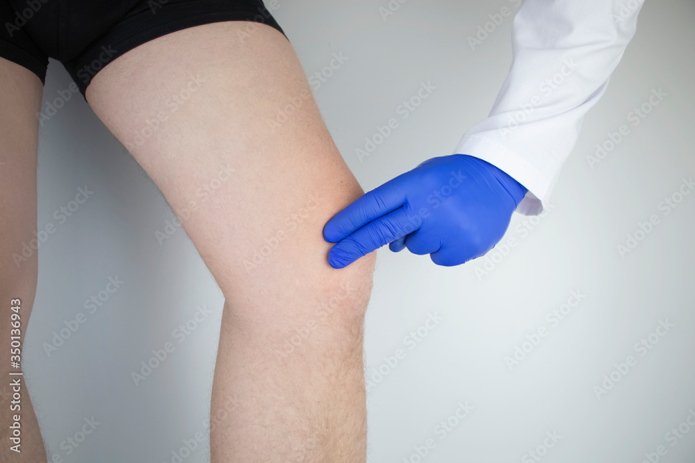 A man suffers from knee pain. Examination by an orthopedist and ...