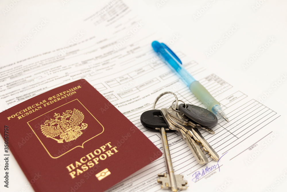 The Russian passport contains documents to fill out and sign on a white ...