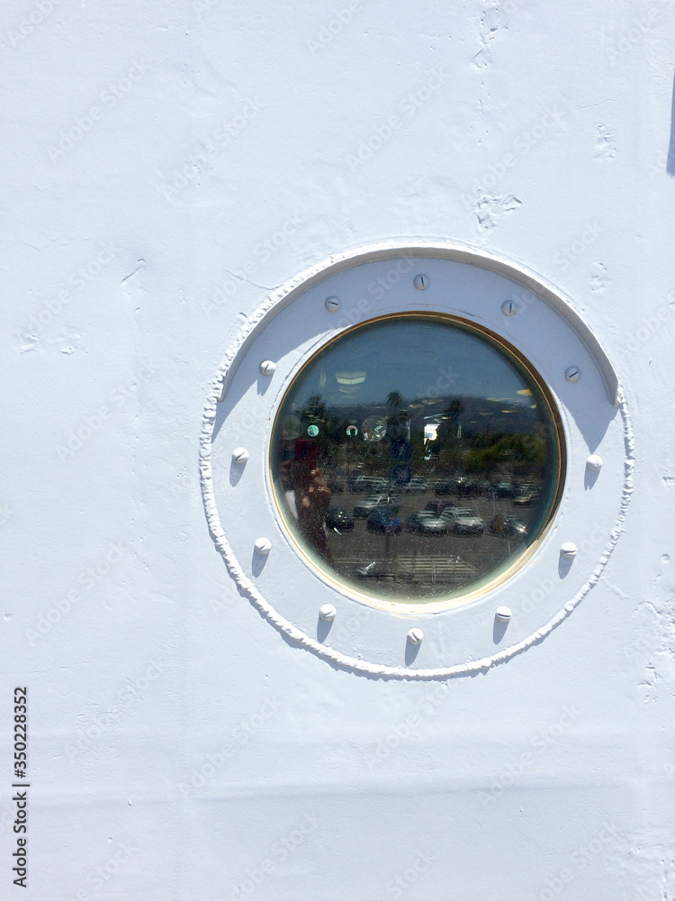 Porthole on metal ship with round circle glass on USS Iowa naval ...