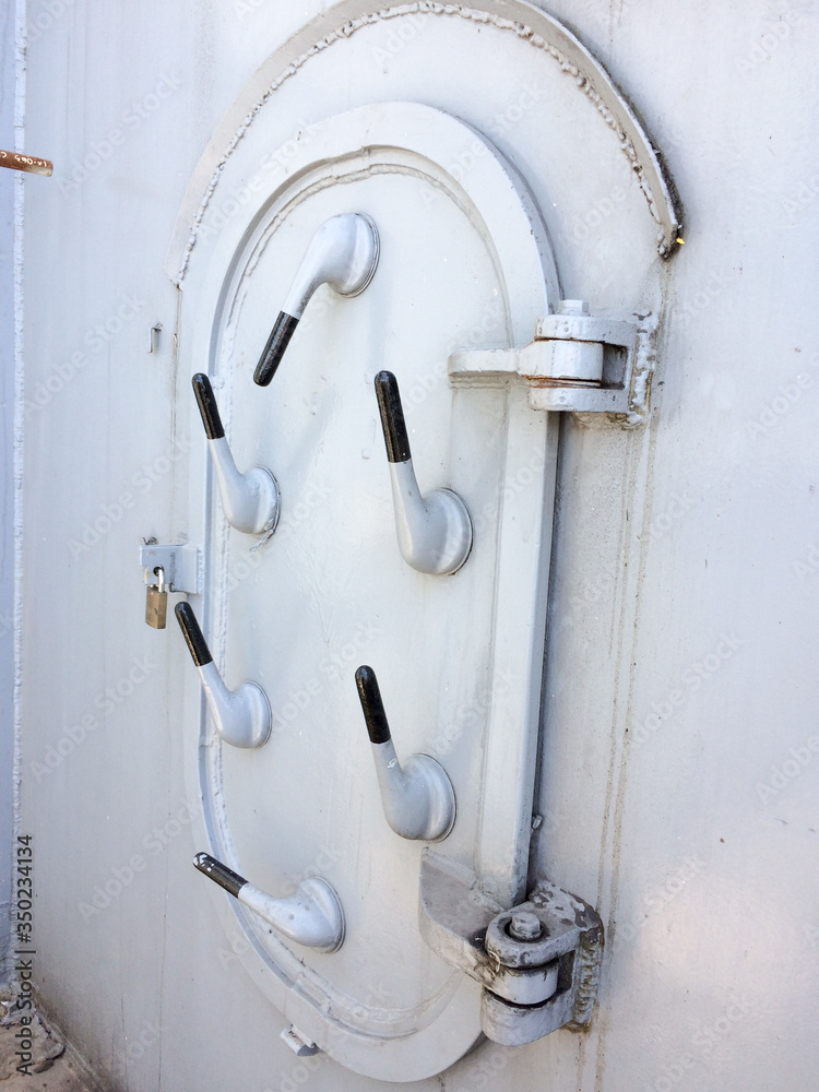 Large metal door water tight hatch locked closed concept on USS Iowa ...