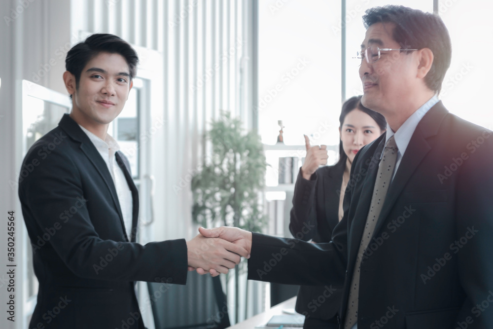 Achievement successful businessmen shaking hands after presentation at ...