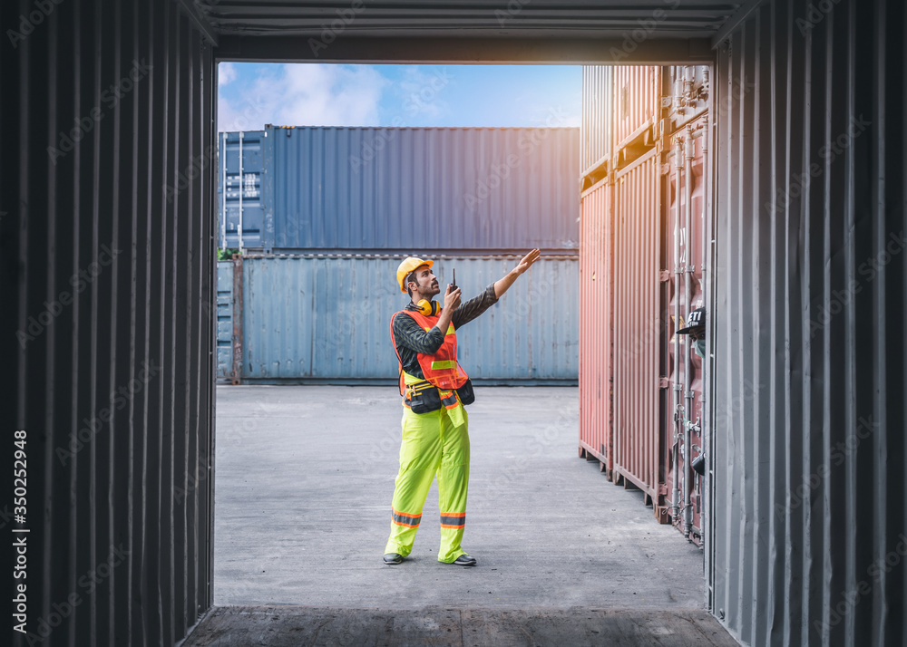 Engineer control loading Container box from Cargo freight ship import ...
