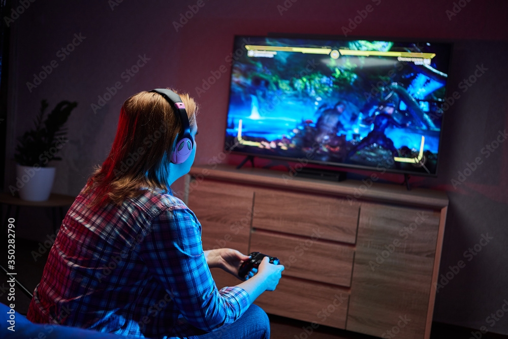 Portrait of crazy playful Gamer enjoying Playing Video Games on ...