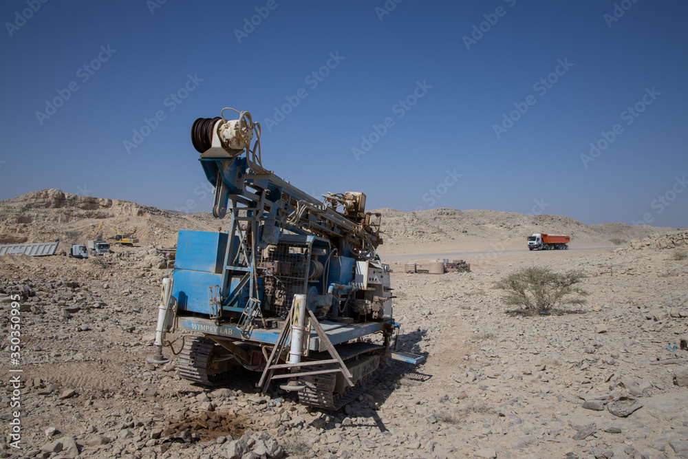 Rock breaking machines breaking hard rocks in the quarries Stock Photo ...