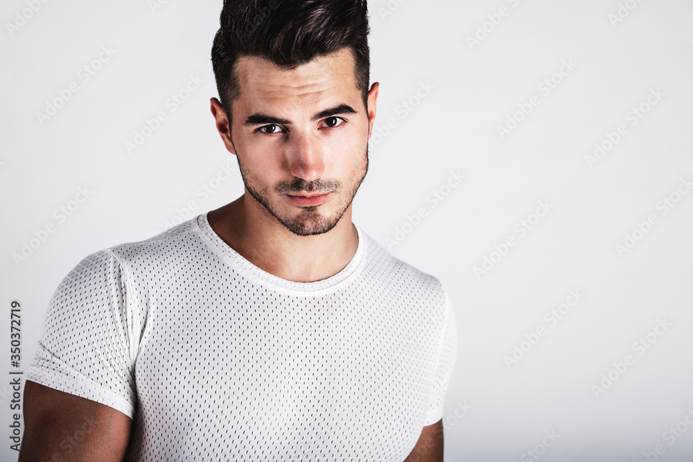 Male beauty concept. Portrait of handsome young man with stylish ...