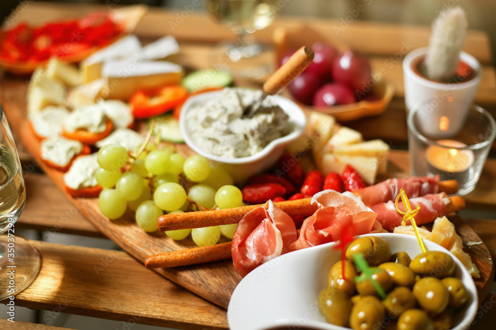 Italian drink aperitif.Traditional Italian snacks (antipasto): salami ...