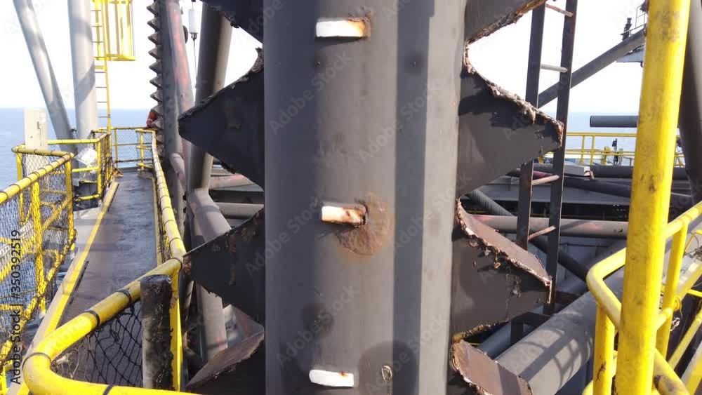 Offshore jack up drilling rig leg during jacking up. General view of ...