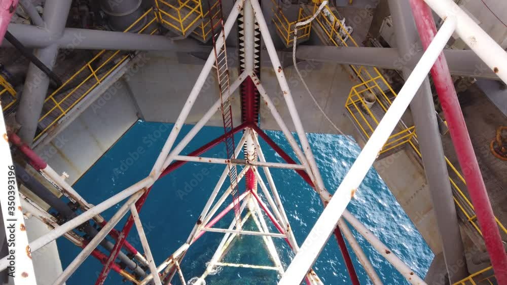 Offshore jack up drilling rig leg during jacking up. General view of ...