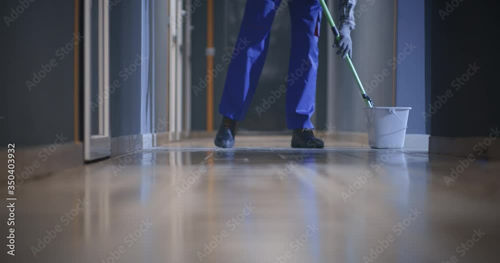 Janitor cleaning a corridor Stock Video | Adobe Stock
