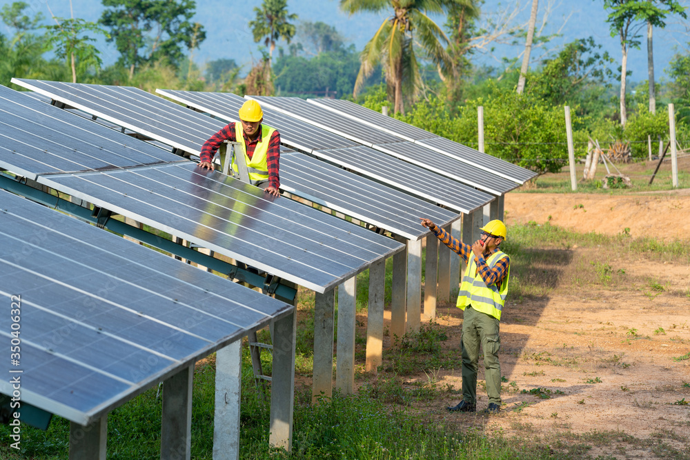 Group of engineer checking solar panel in routine operation at solar ...
