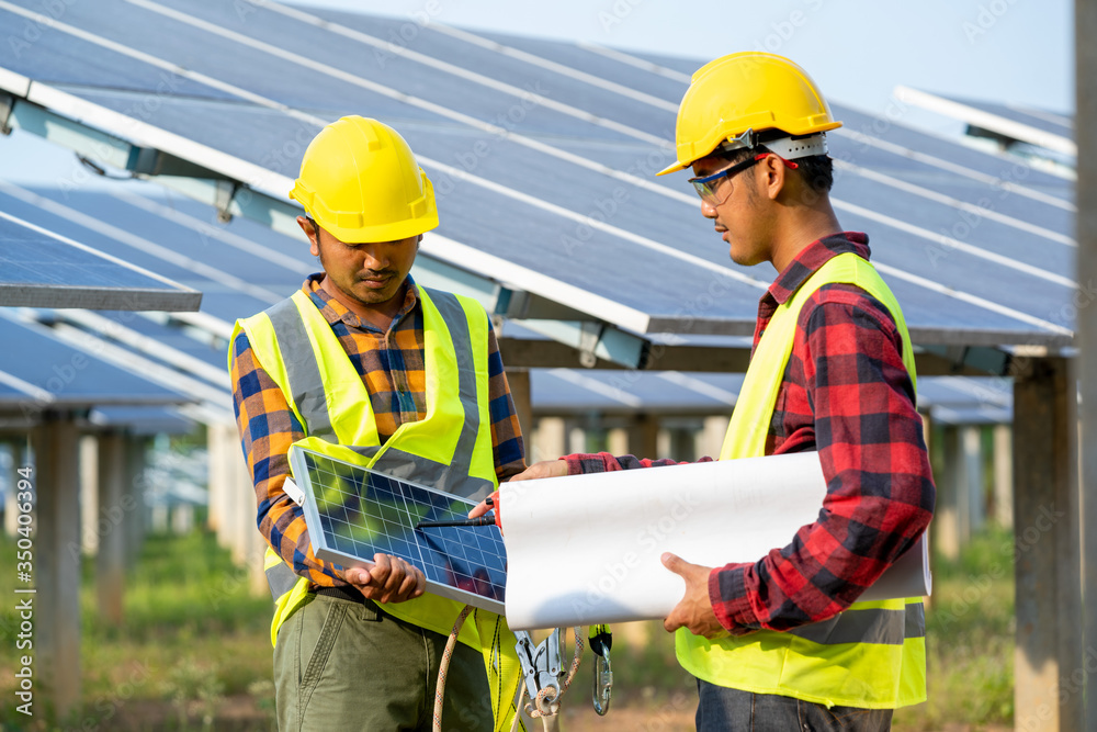 Group of engineer checking solar panel in routine operation at solar ...