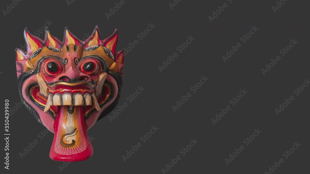 4K stop motion video of a wooden Balinese Barong Mask on black ...