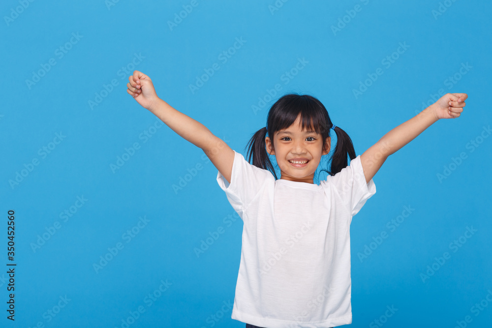little girls raising their two hands up Stock Photo | Adobe Stock